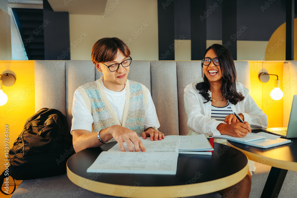 Students collaborating in a cozy study area, engaging in teamwork with ...