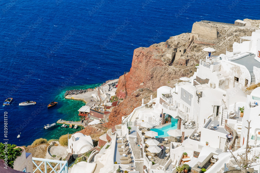 Bird's-eye view of Amoudi Bay and the cliffs of Santorini Stock Photo ...