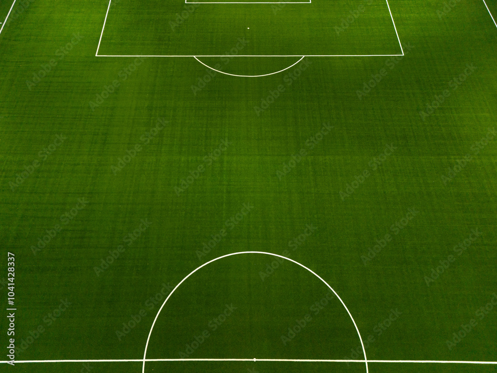 Green grass and white lines. Aerial closeup of the midfield circle and ...