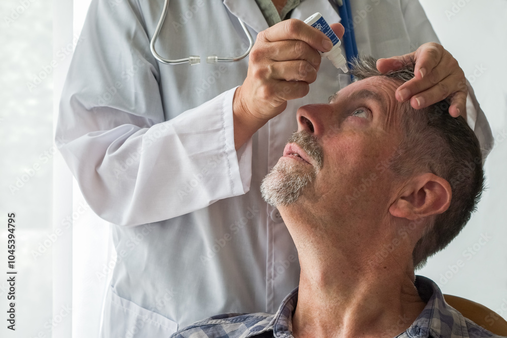 Eye examination a doctor puts eyedrop medication into a man's eye ...