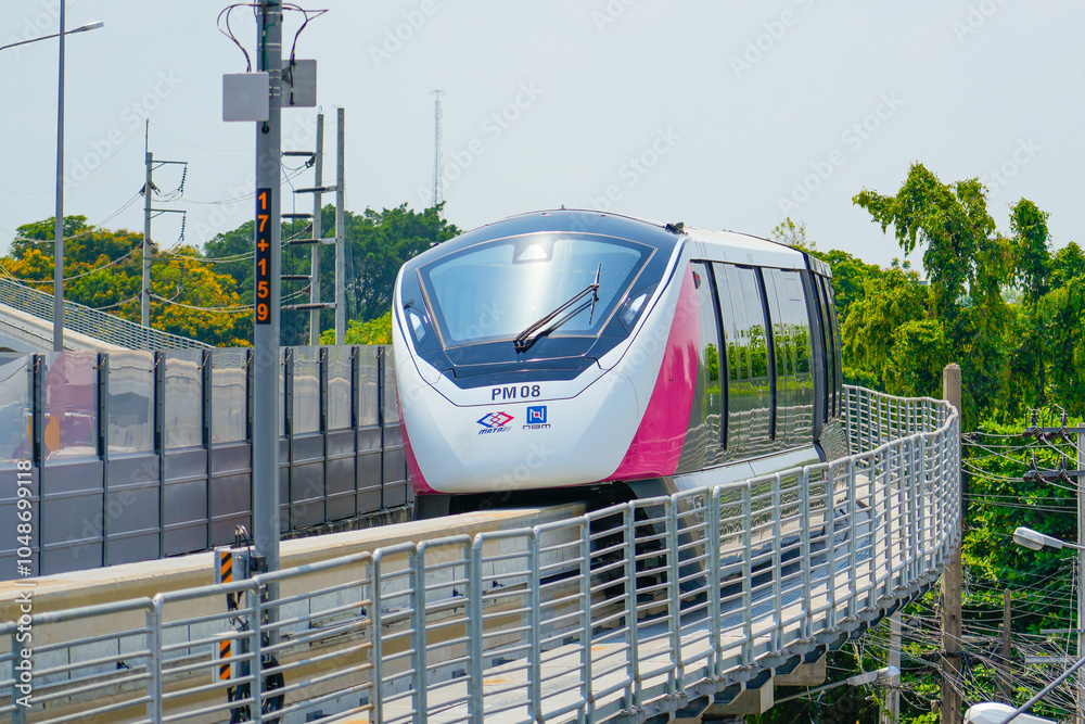 MRTA nbm pink monorail line unmanned passes turn arriving at the ...