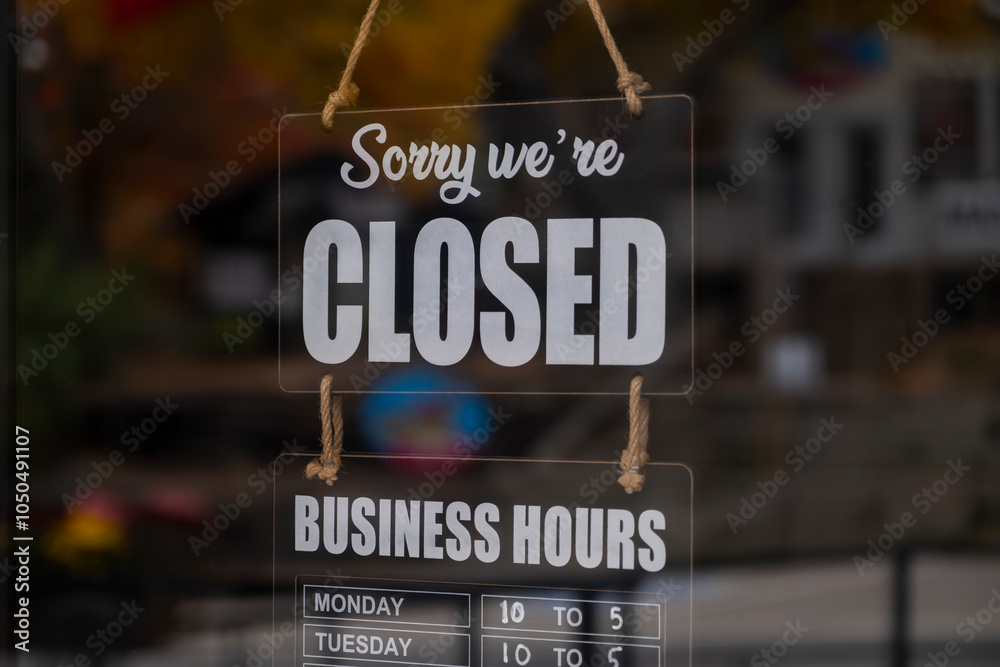 Sign sorry we are closed hanging at the store front glass door. Stock ...