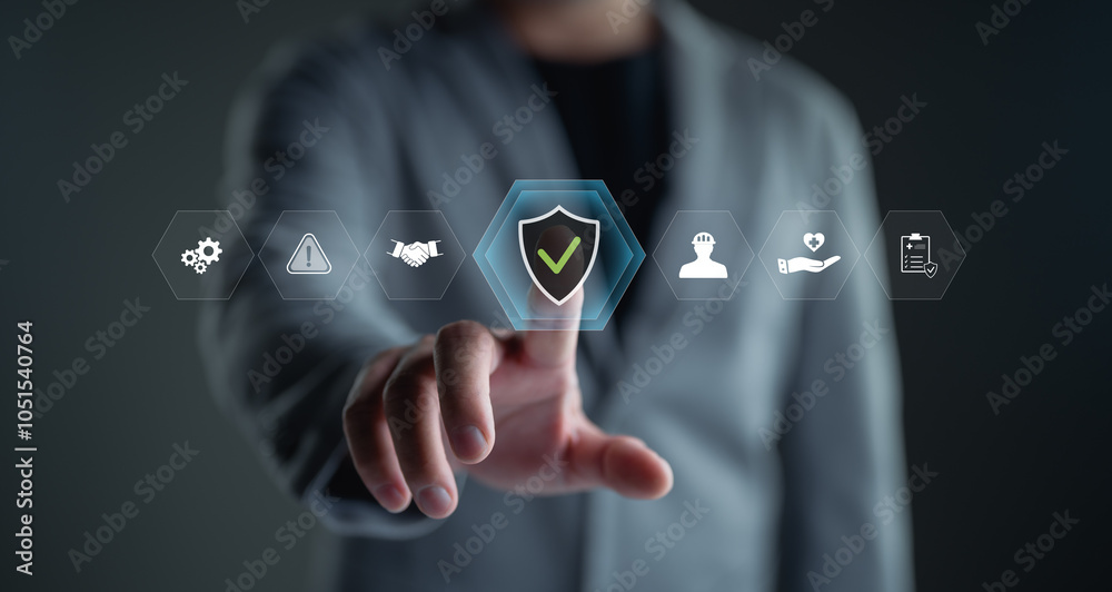 Work safety concept. Businessman show the icon of safety at workplace ...