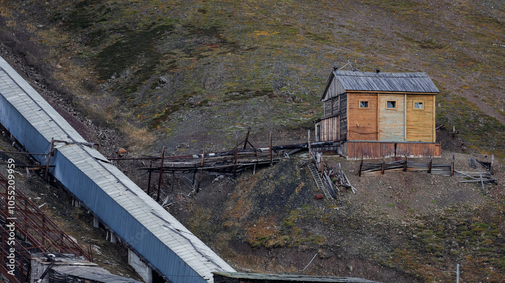 Abandoned coal mine structure at Pyramiden in Svalbard surrounded by ...