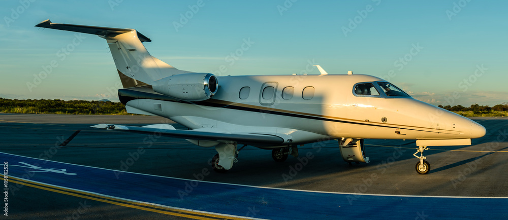 Imposing twin-turbo private jet plane parked at an airport on the ...