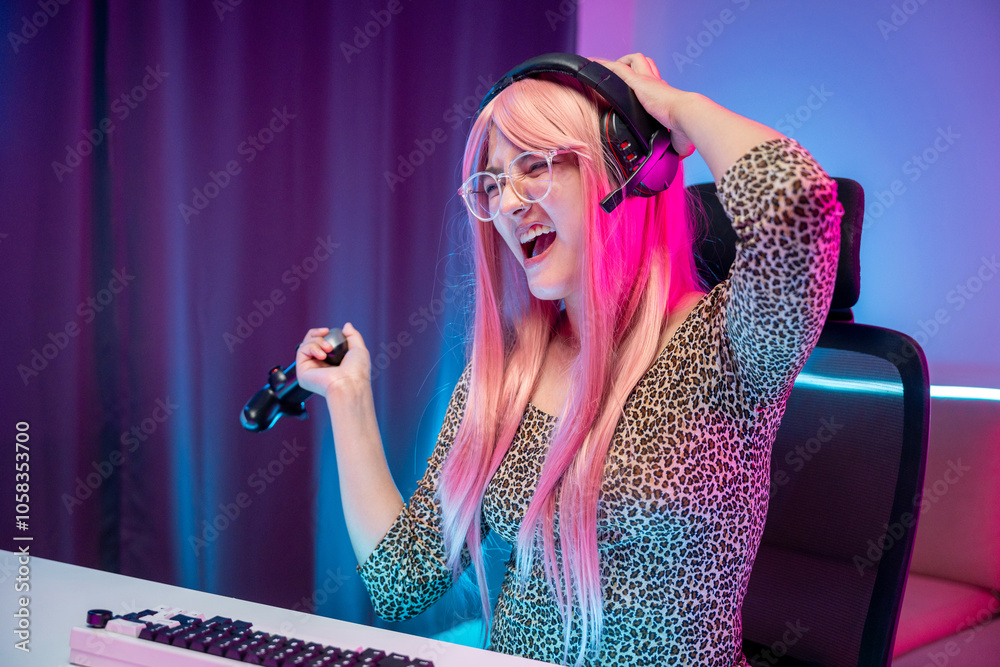 Professional gamer. Young asian pretty woman sitting on chair with ...