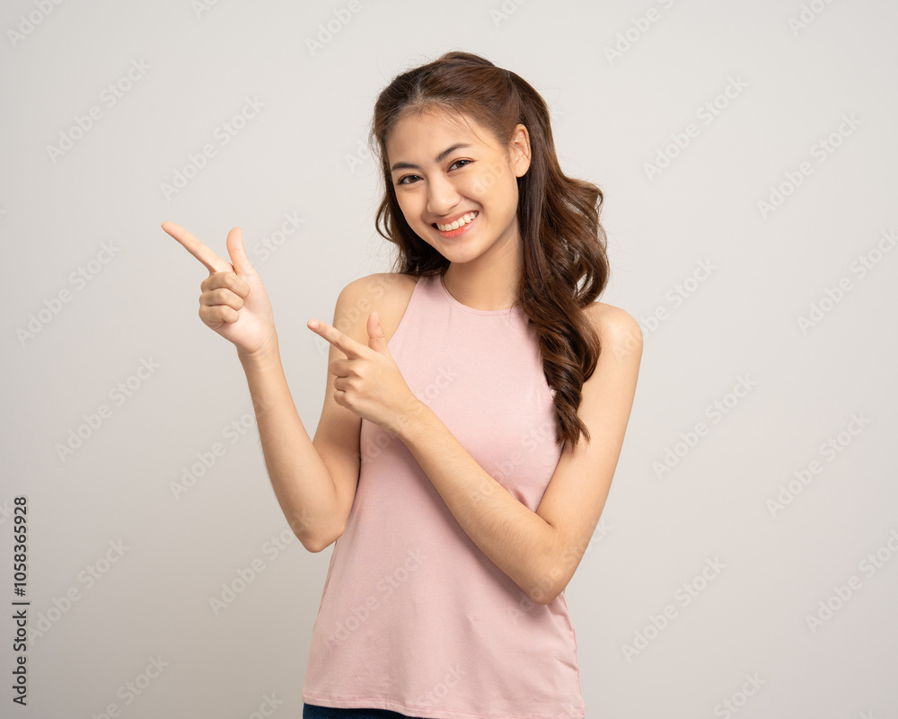 Beautiful happy young asian woman age around 25 pointing finger hands ...