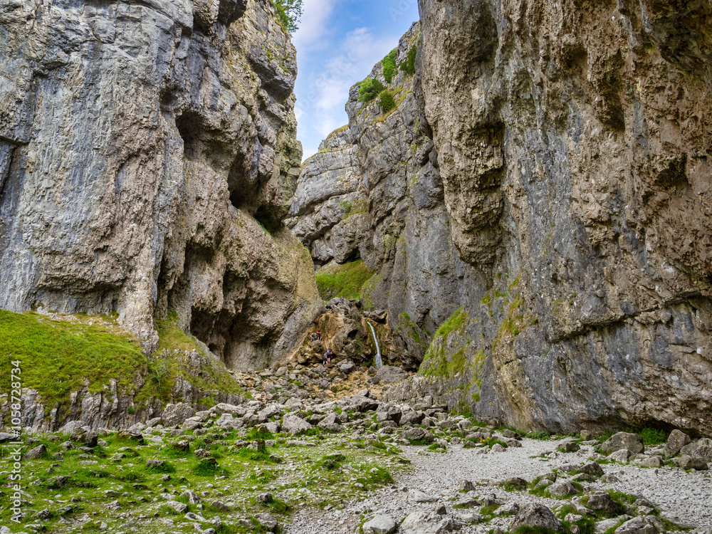 Gordale Scar, a limestone ravine with overhanging limestone cliffs over ...