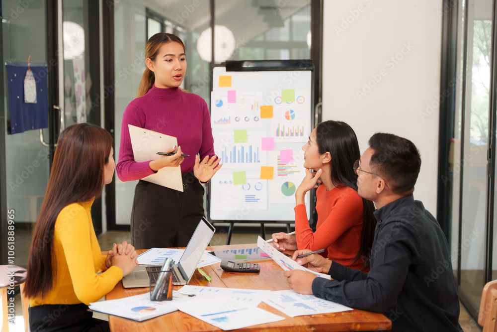 Group of Asian businessmen are sitting in a meeting, talking ...
