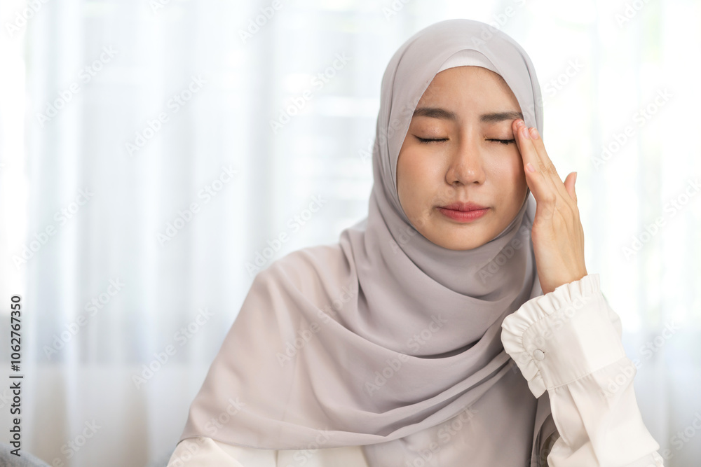 Young muslim woman in hijab experiencing stress and fatigue, headache ...