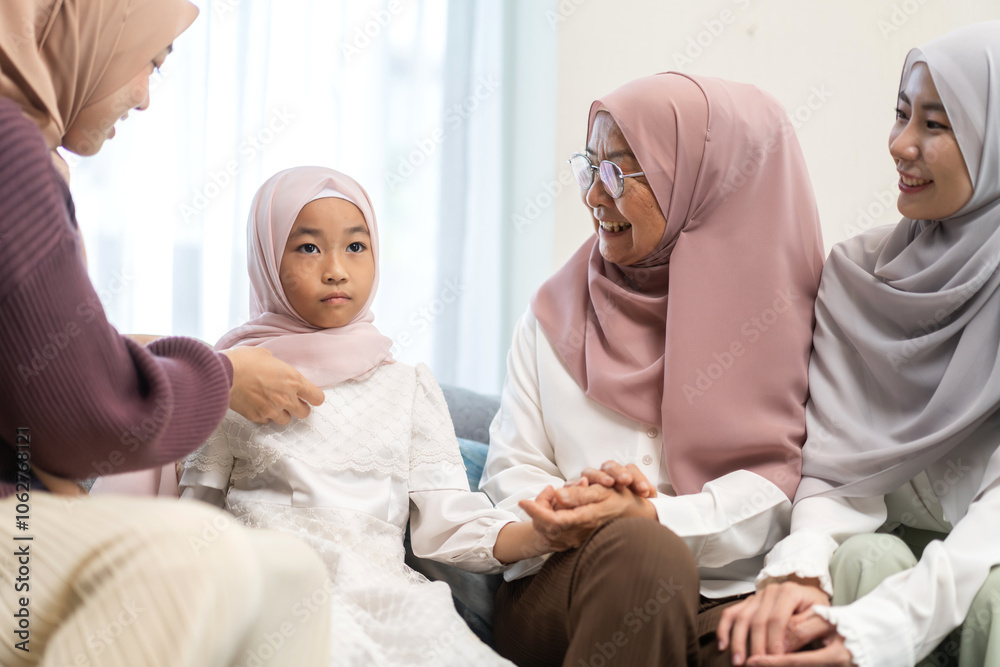 Four generations of muslim woman in hijab enjoying family time showing ...