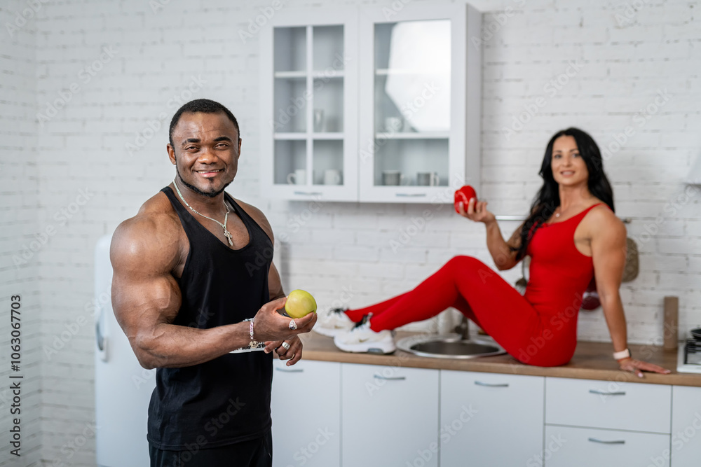 Healthy lifestyle couple preparing food in kitchen. A couple in a ...
