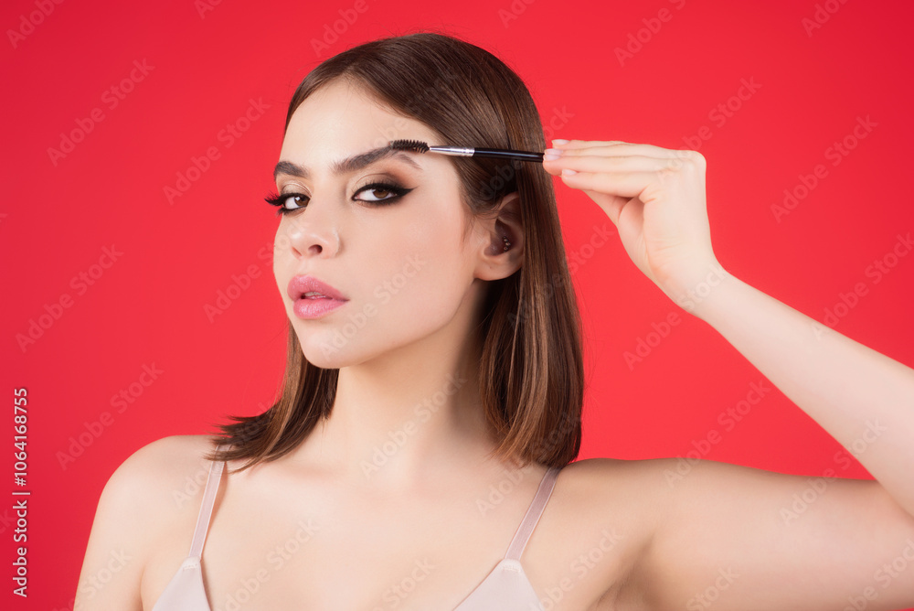 Eyebrow shaping, woman combs eyebrows with a brus. Eyebrow line. Makeup ...