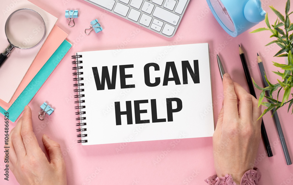 We Can Help Text on Notepad With Hands on The Office, Pink Background ...