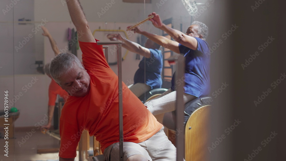 Senior Man and Woman Engaging in Strength and Flexibility in Pilates ...