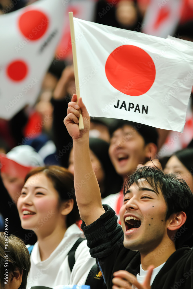 Joyful Japanese Soccer Fan Waving Flag in Stadium. A young Japanese man ...