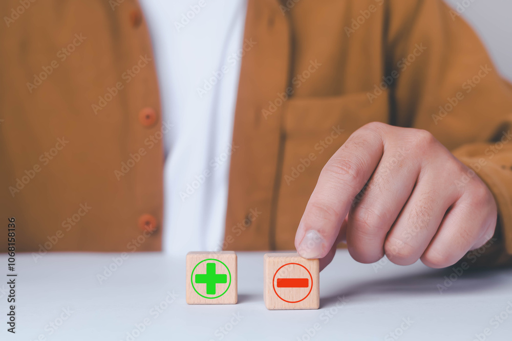 Plus minus wood block, A man placing wooden blocks with plus minus ...