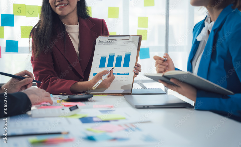 Charting Success: A professional team collaborates in a modern office ...
