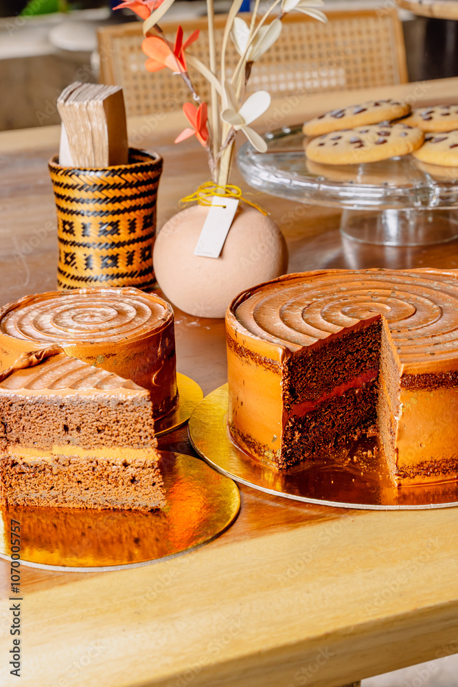 Delicious chocolate cakes, spongy and soft, a split slice. Gastronomy ...