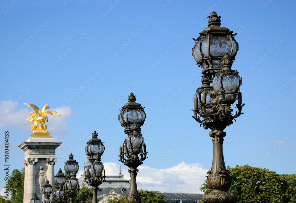 Beautiful forging lamps and golden statues of Alexander III Bridge ...