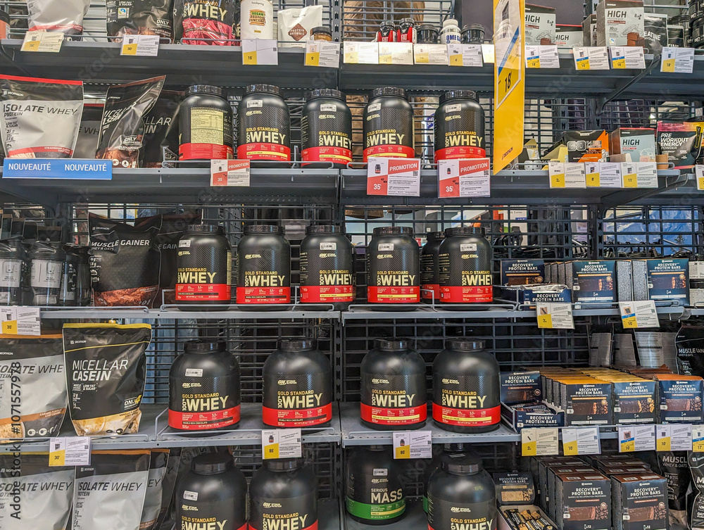 France, 09 May 2024 : Variety of whey protein powders on store shelf ...
