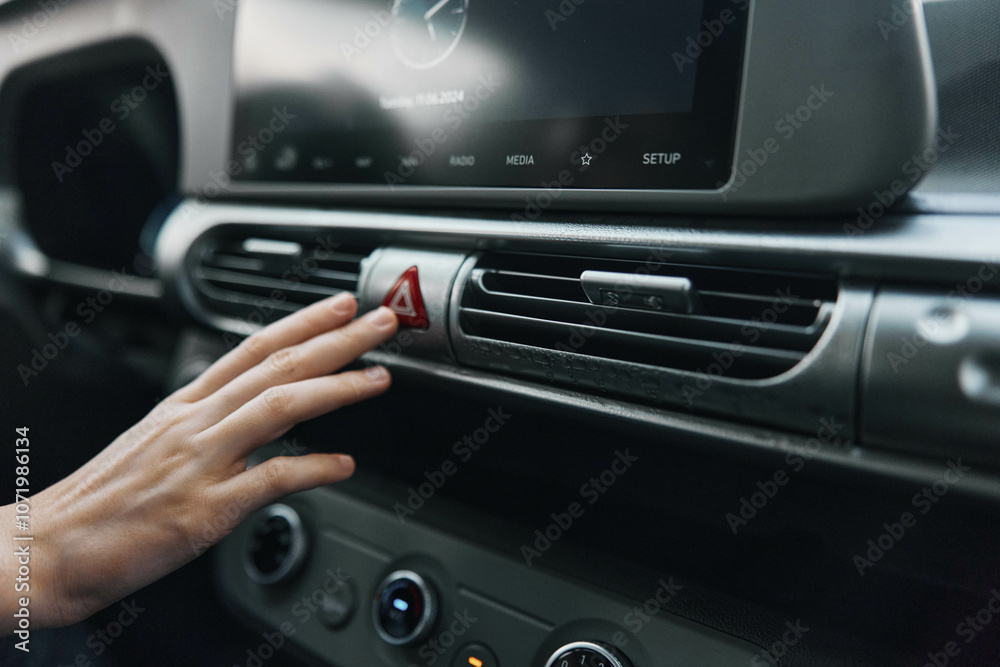 Car air conditioning control a person adjusting an air vent with a red ...