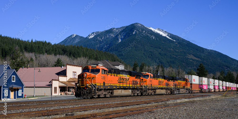 Skykomish, WA, USA - November 6, 2024; BNSF intermodal freight train passes through Skykomish ...