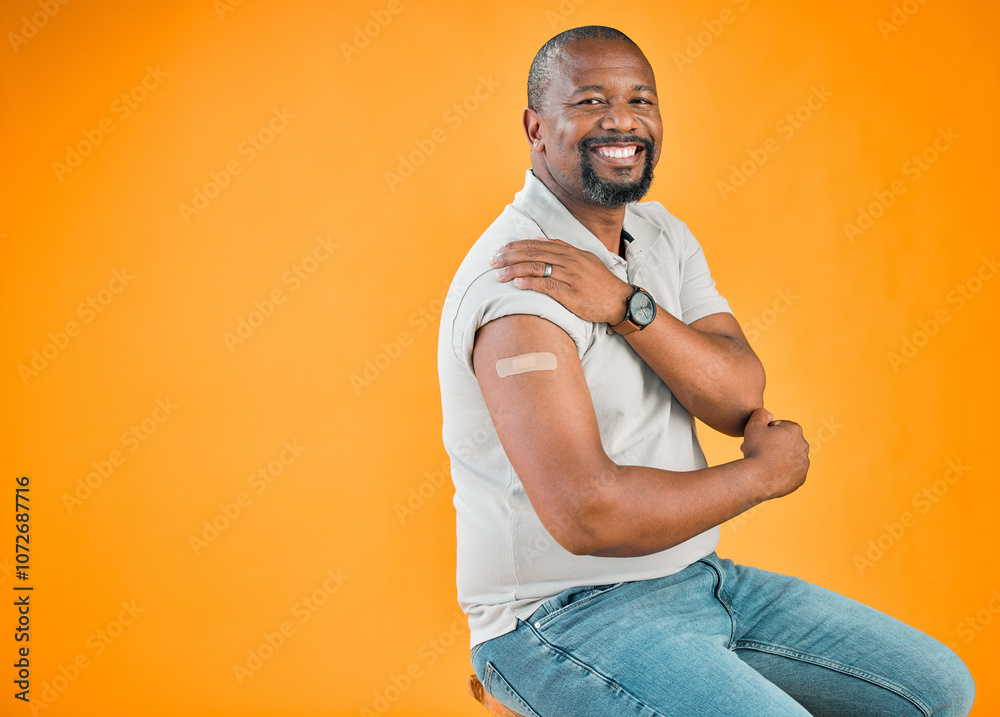 Black man, vaccine and smile in studio background with plaster for ...