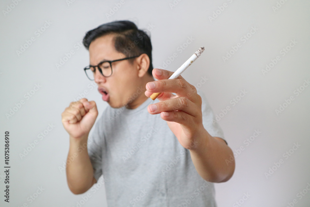 Male smoker holding a cigarette suffering from chronic cough,asian man ...