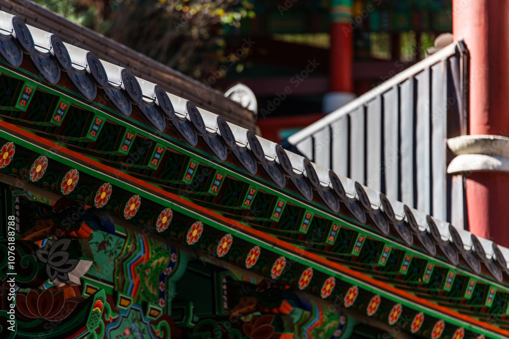 painted eaves of the traditional Korean building in the Buddhist temple ...