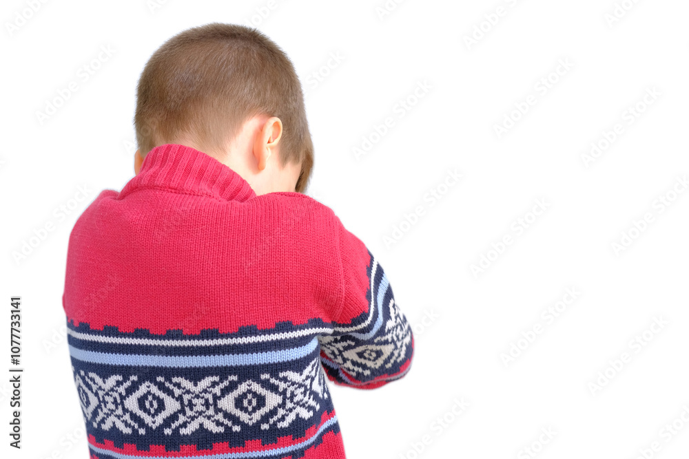 child in sweater turned away, boy 8 years old, mouth twisted in ...