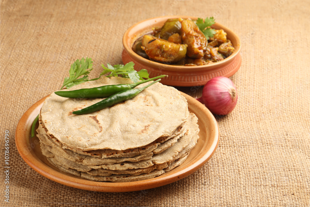 Jowar Roti or Jowar Bhakri with brinjal curry , a staple food in the ...