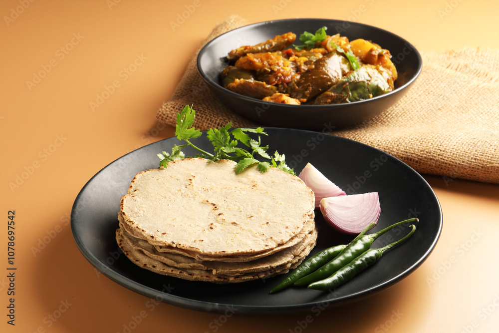 Jowar Roti or Jowar Bhakri with brinjal curry , a staple food in the ...