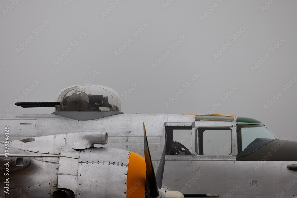 Close side view oof the cockpit and dorsal turret of a WWII era bomber ...
