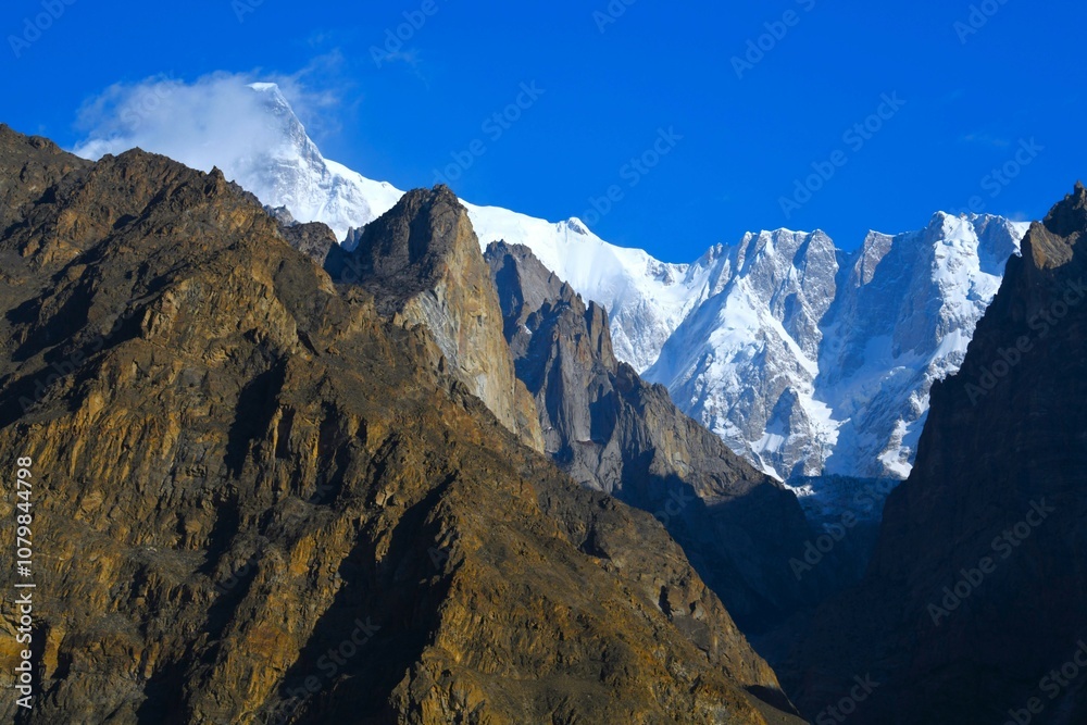 Scenic view of the ridge of Ultar Sar massif that rises precipitously ...