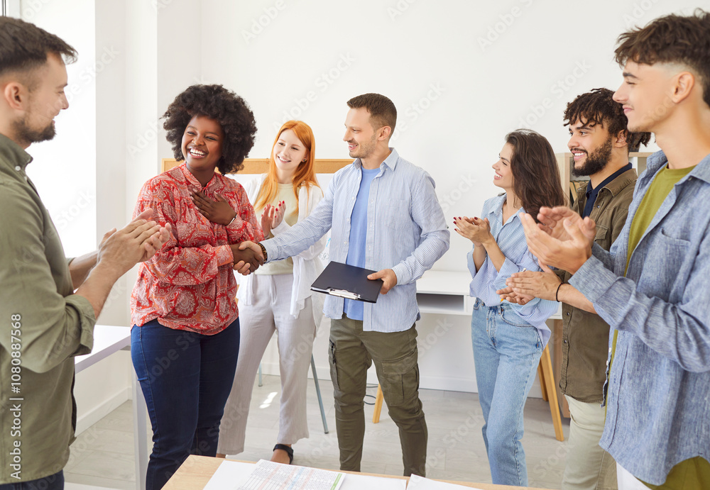 Foto de Stock Boss shakes hands with an employee during a successful ...