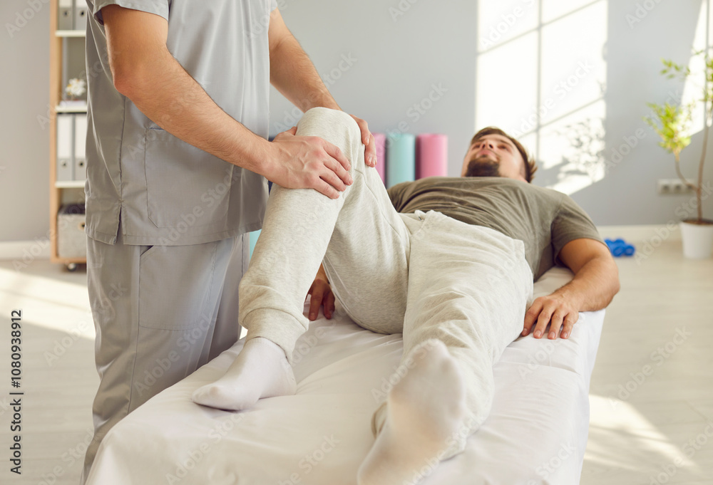 Therapist engaged a rehabilitation or physiotherapy session for a man ...