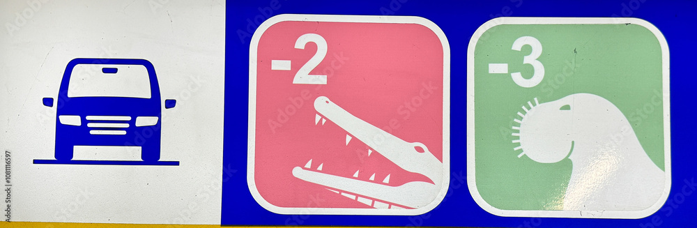 Warning signs indicating vehicle access to reptile exhibit with ...