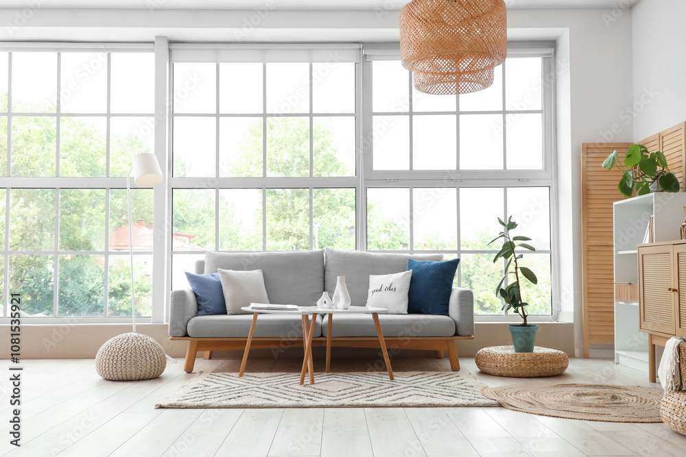 Interior of modern living room with grey sofa and coffee table near ...