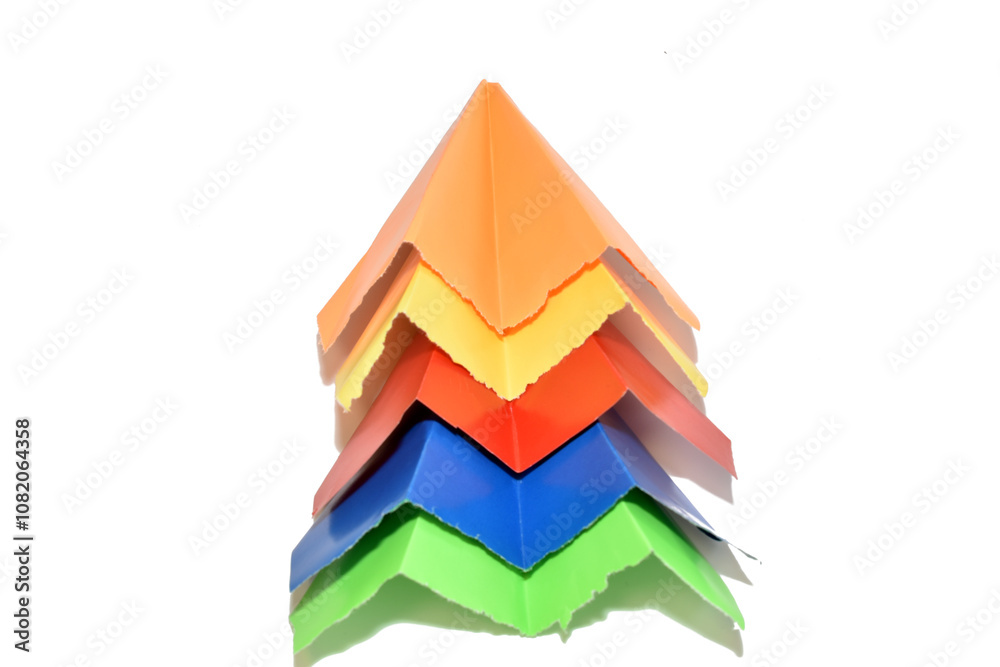 Paper airplanes of different colors are inserted into each other and ...