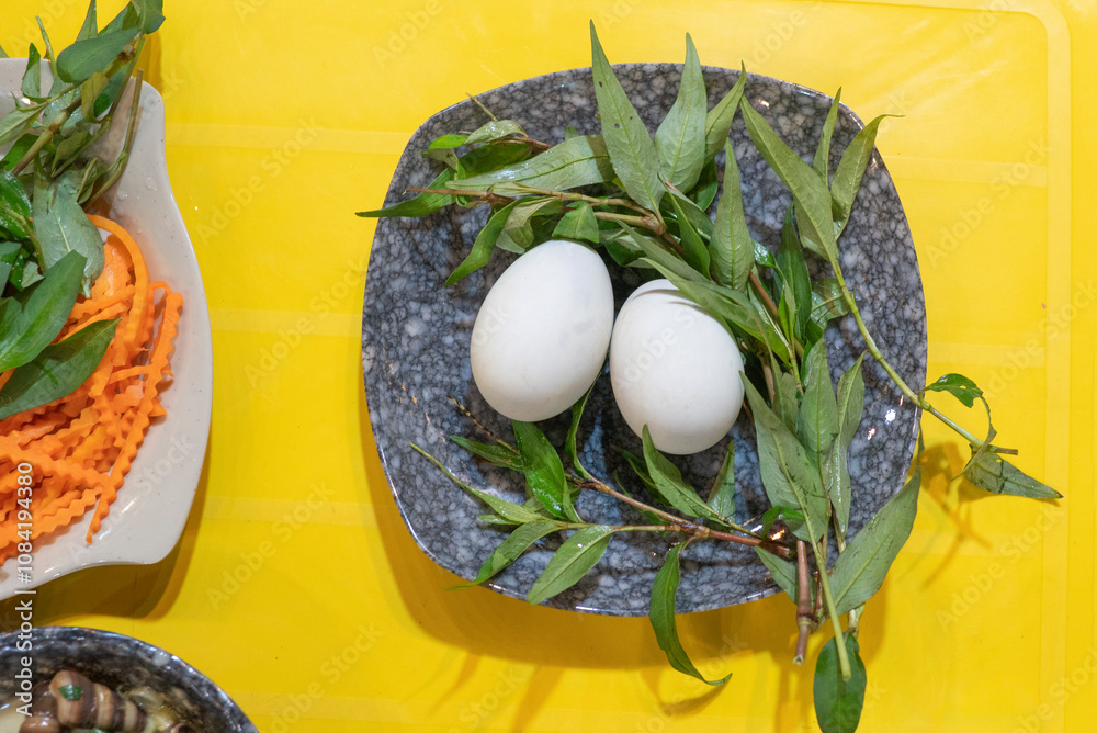 Vietnam street food. A bowl of duck eggs. Balut (boiled duck developing ...
