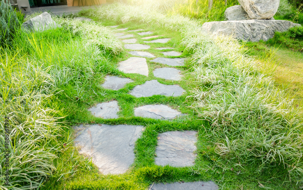 Walkway and bush in garden. Also called concrete pavement, floor ...