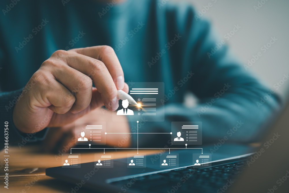 Organization chart, mind map. The businessman uses pen to draw an ...