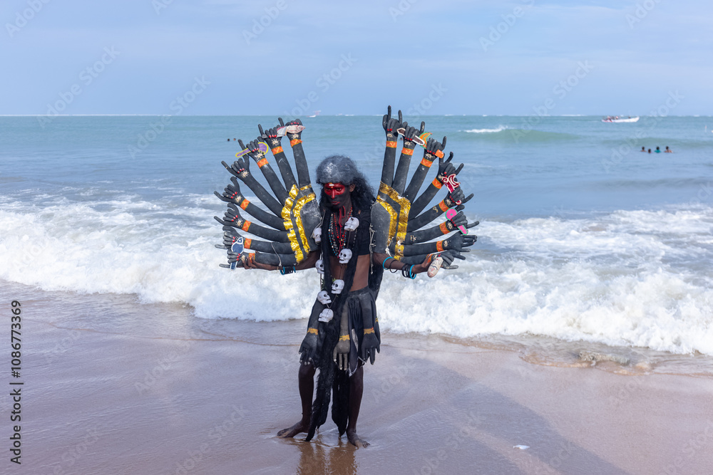 Kulasai Dasara, Portrait of indian male with painted face and dressed ...