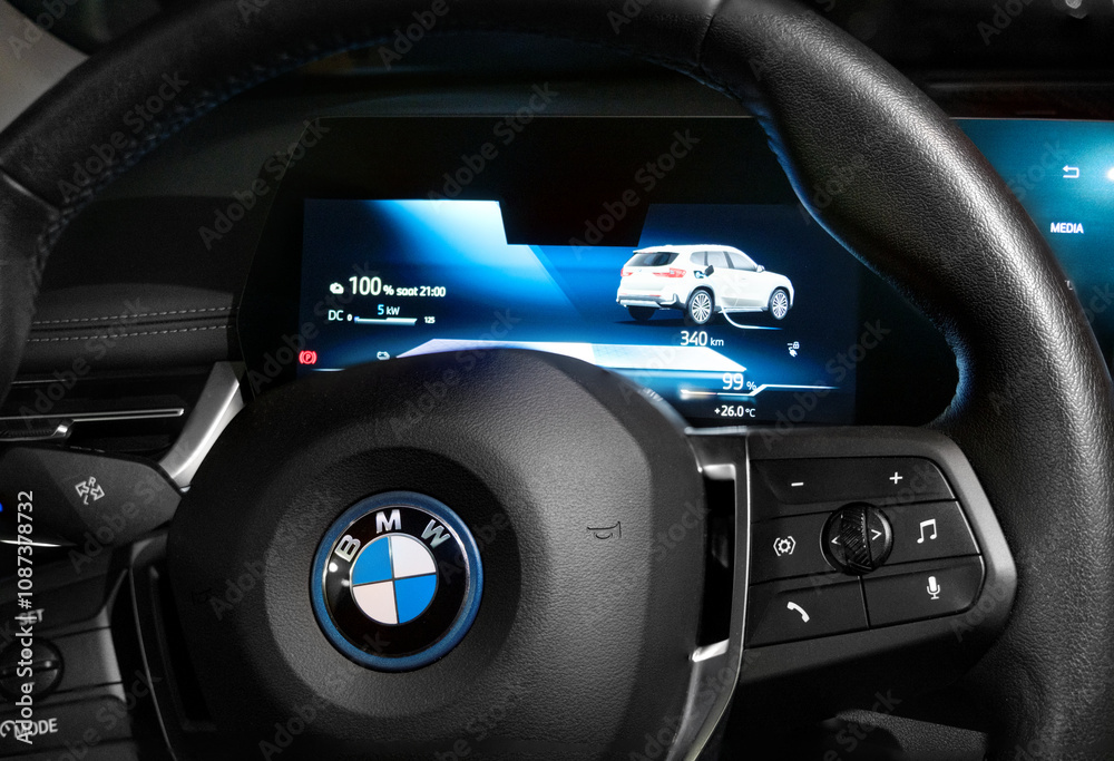 Close-up of BMW IX1 e-drive 20 electric SUV steering wheel and digital ...