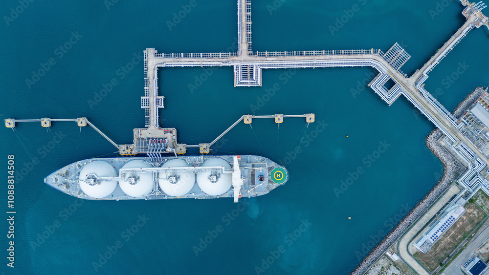 LNG (Liquified Natural Gas) tanker anchored in Gas terminal gas tanks ...
