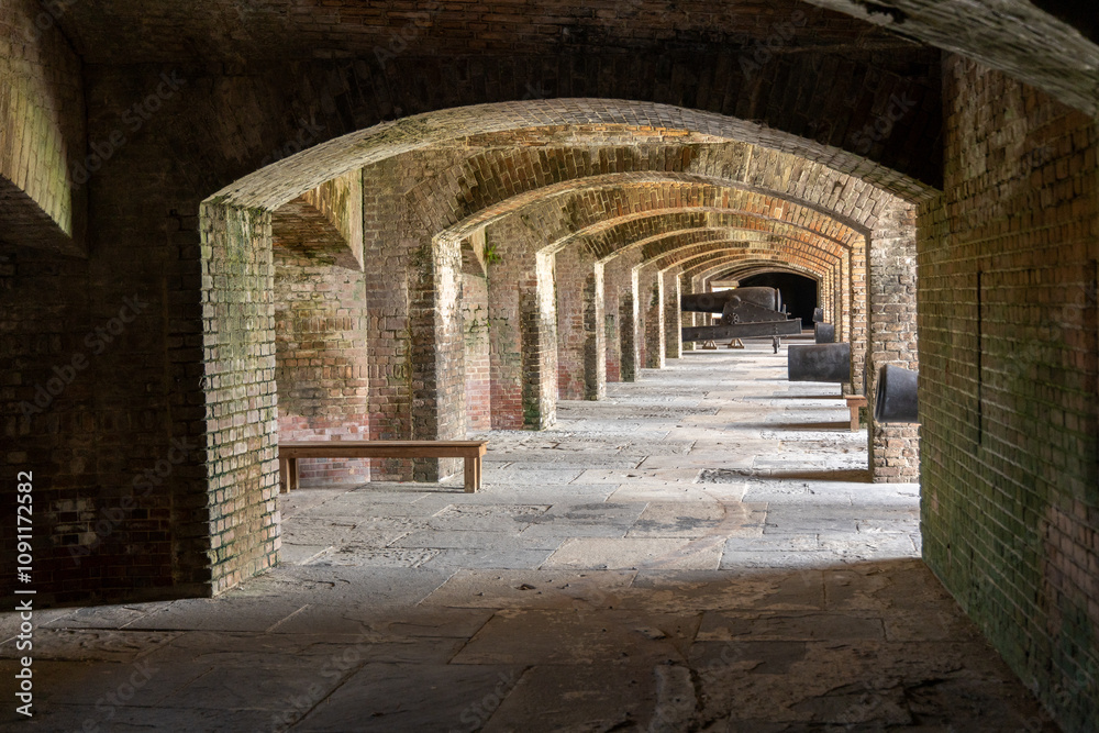 Historical brick fort with arched corridors, antique cannons, and ...