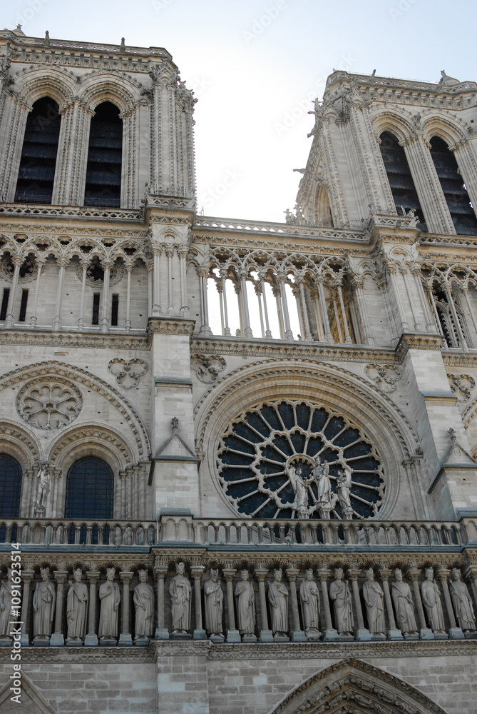 The facade of the famous landmark, the Notre Dame building in Paris ...