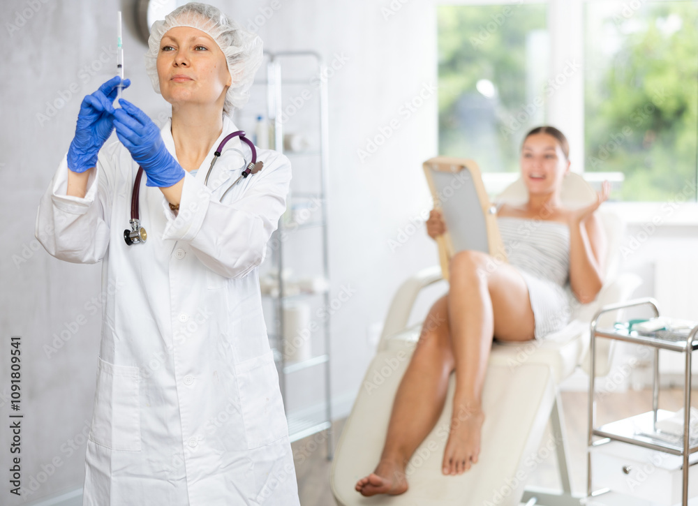 Female doctor in medical clothes and disposable cap examines integrity ...