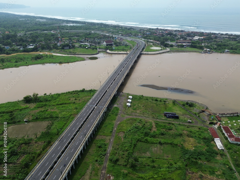 Aerial photograph showing a highway bridge spanning a wide river ...